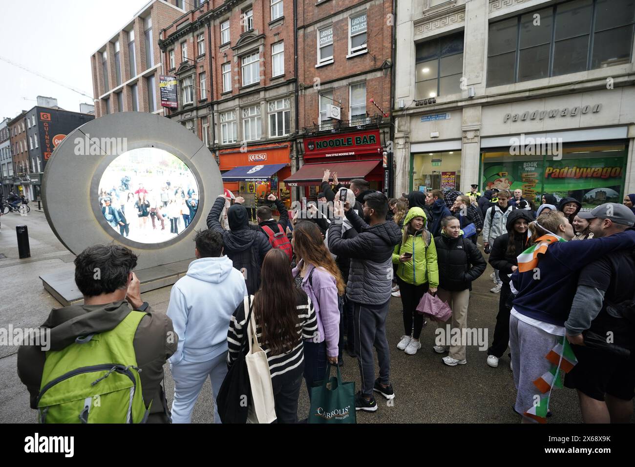 People view the live stream portal between Dublin and New York which ...