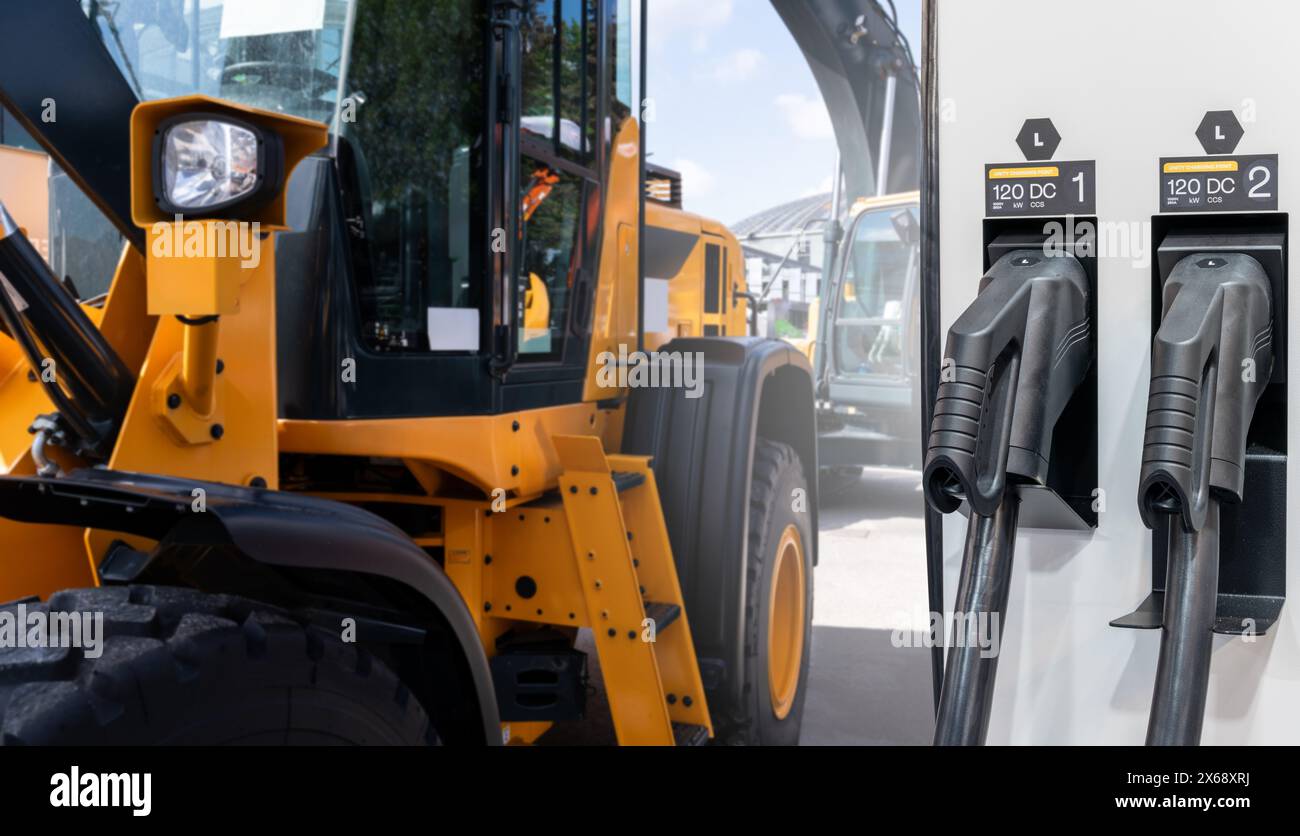 Electric construction machines with charging station. Concept Stock ...