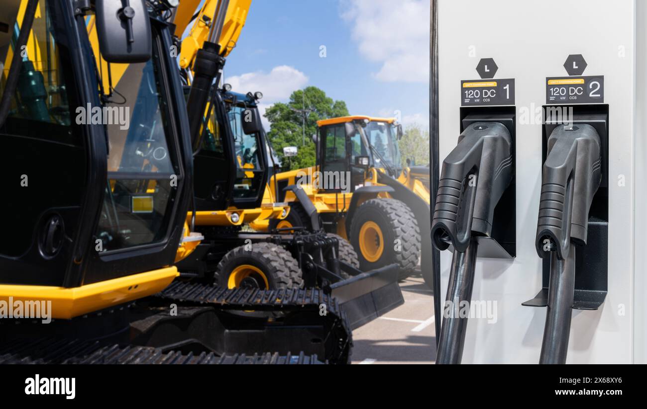 Electric construction machines with charging station. Concept Stock ...