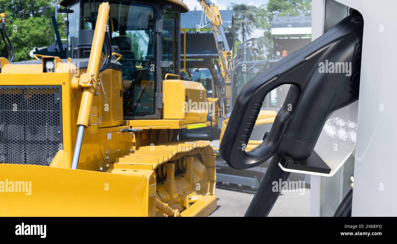 Electric construction machines with charging station. Concept Stock ...