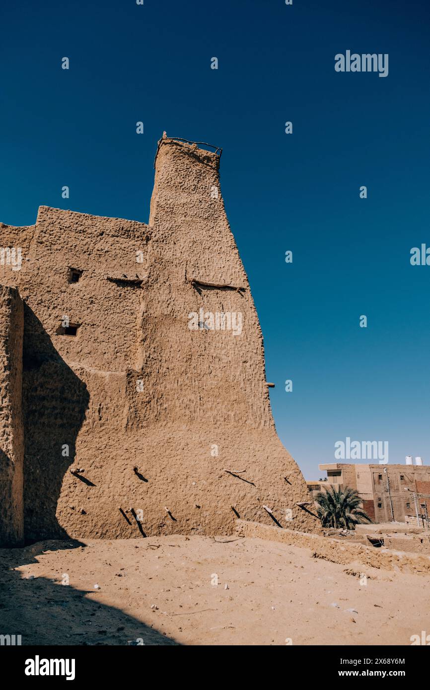 Ancient mud-brick fortress in Siwa Oasis, Egypt under blue sky Stock ...