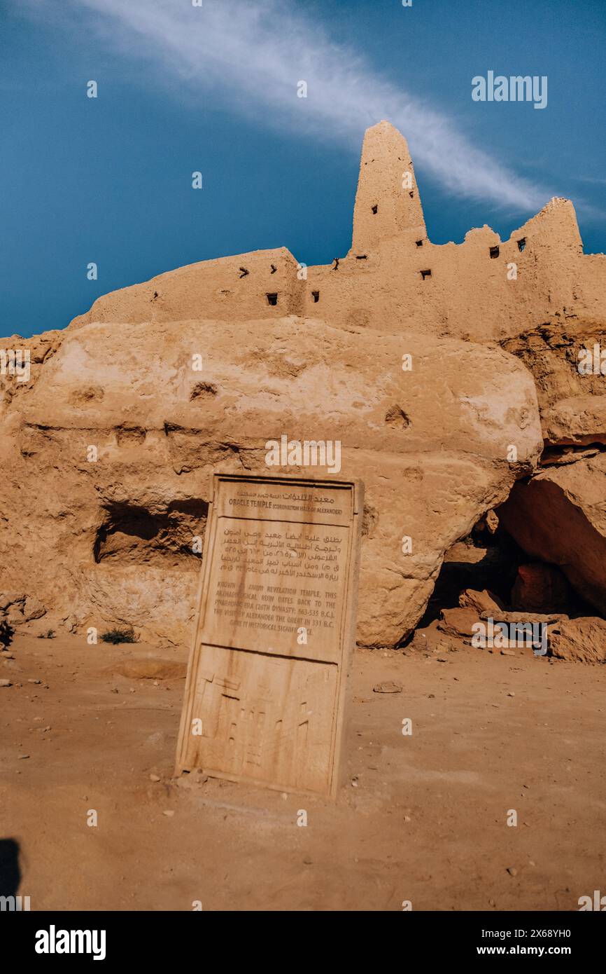 Ancient ruins of the Oracle Temple with an information sign, located in ...