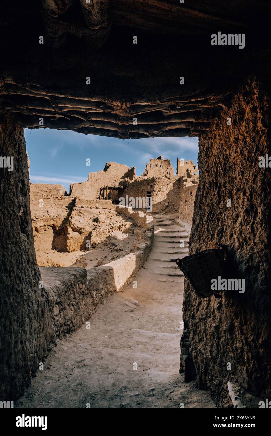 Ancient stone ruins of the Oracle Temple under a blue sky, Siwa Oasis ...