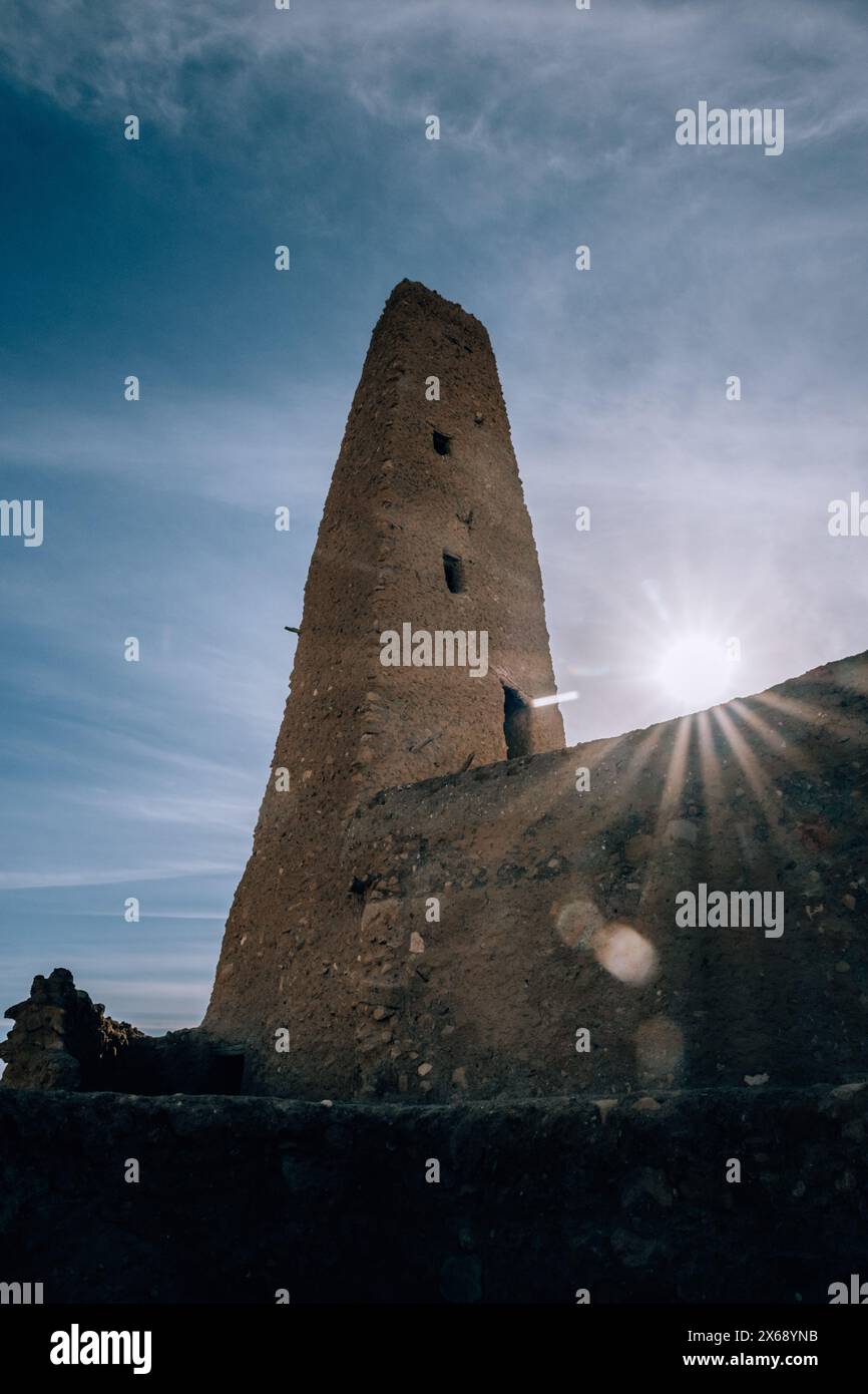 Sun shining behind the ancient ruins of the Oracle Temple, Siwa Oasis ...