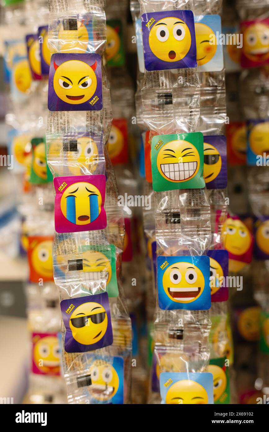 Sweets in plastic packaging with emojis Stock Photo - Alamy
