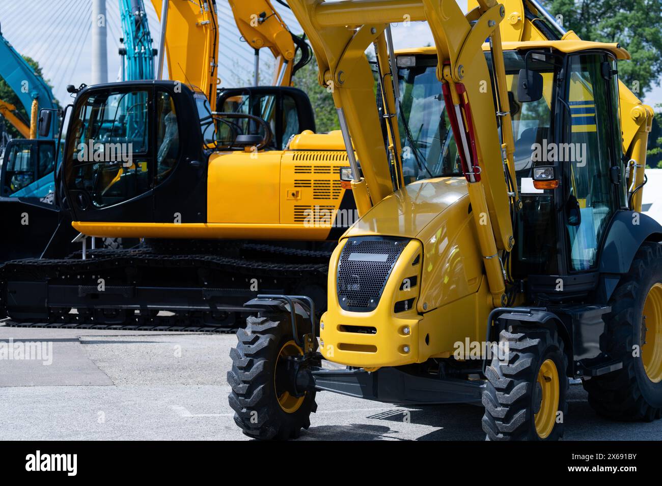 Fleet of yellow construction machines Stock Photo - Alamy