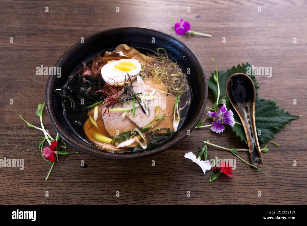 Famous orc ramen bowl cooked for lunch. Asiatic food ready to be eat ...