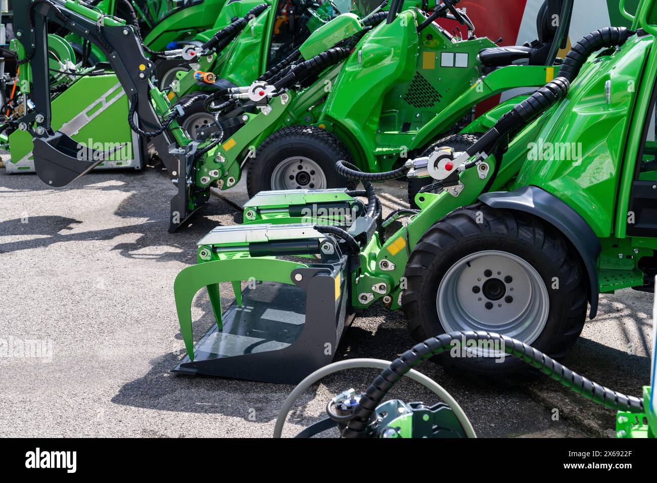 Fleet of green road machines Stock Photo - Alamy