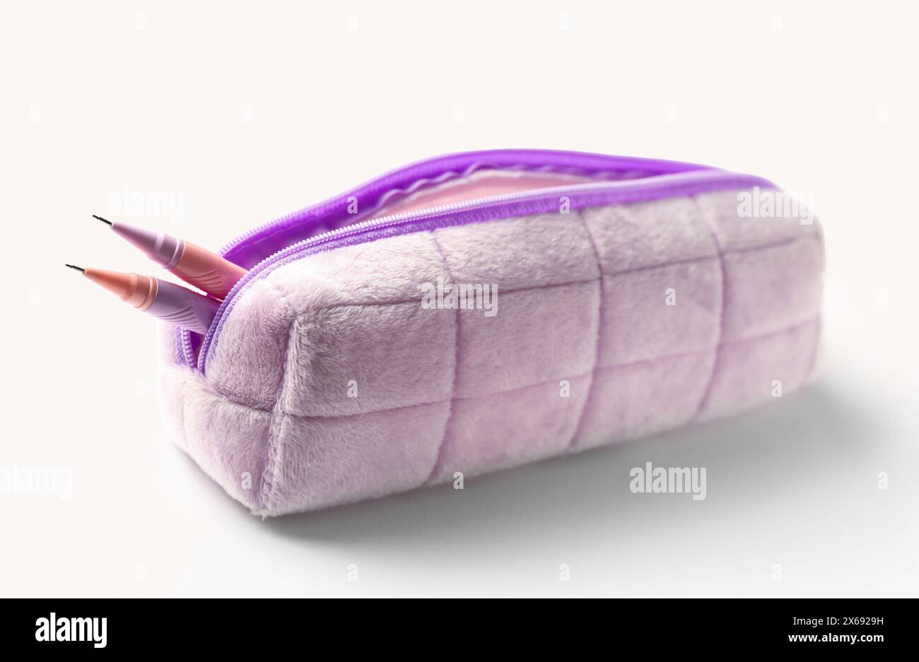 Light purple pencil case with stationery on white background Stock ...
