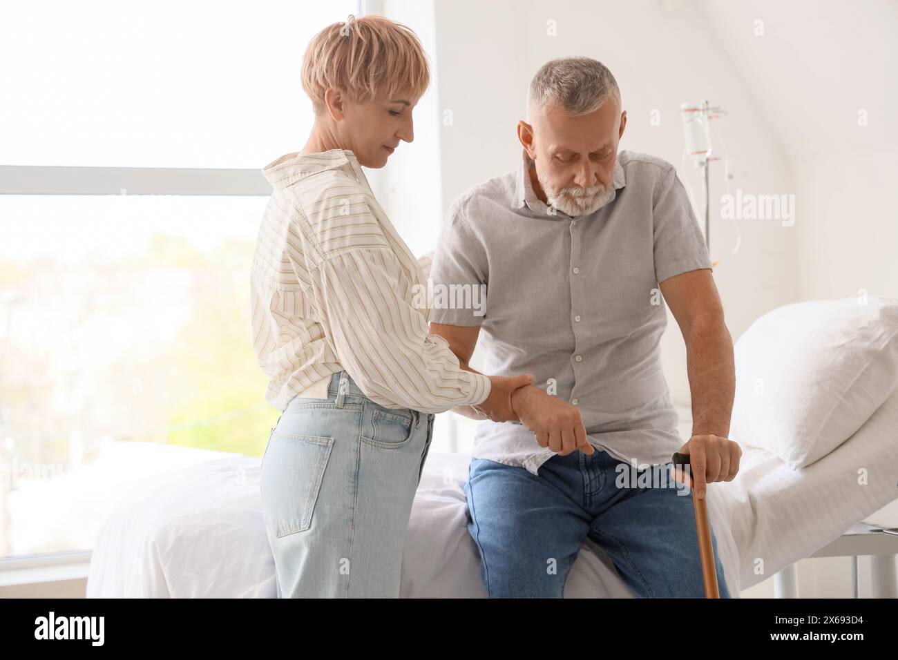 Elderly wife helping husband in hi-res stock photography and images - Alamy