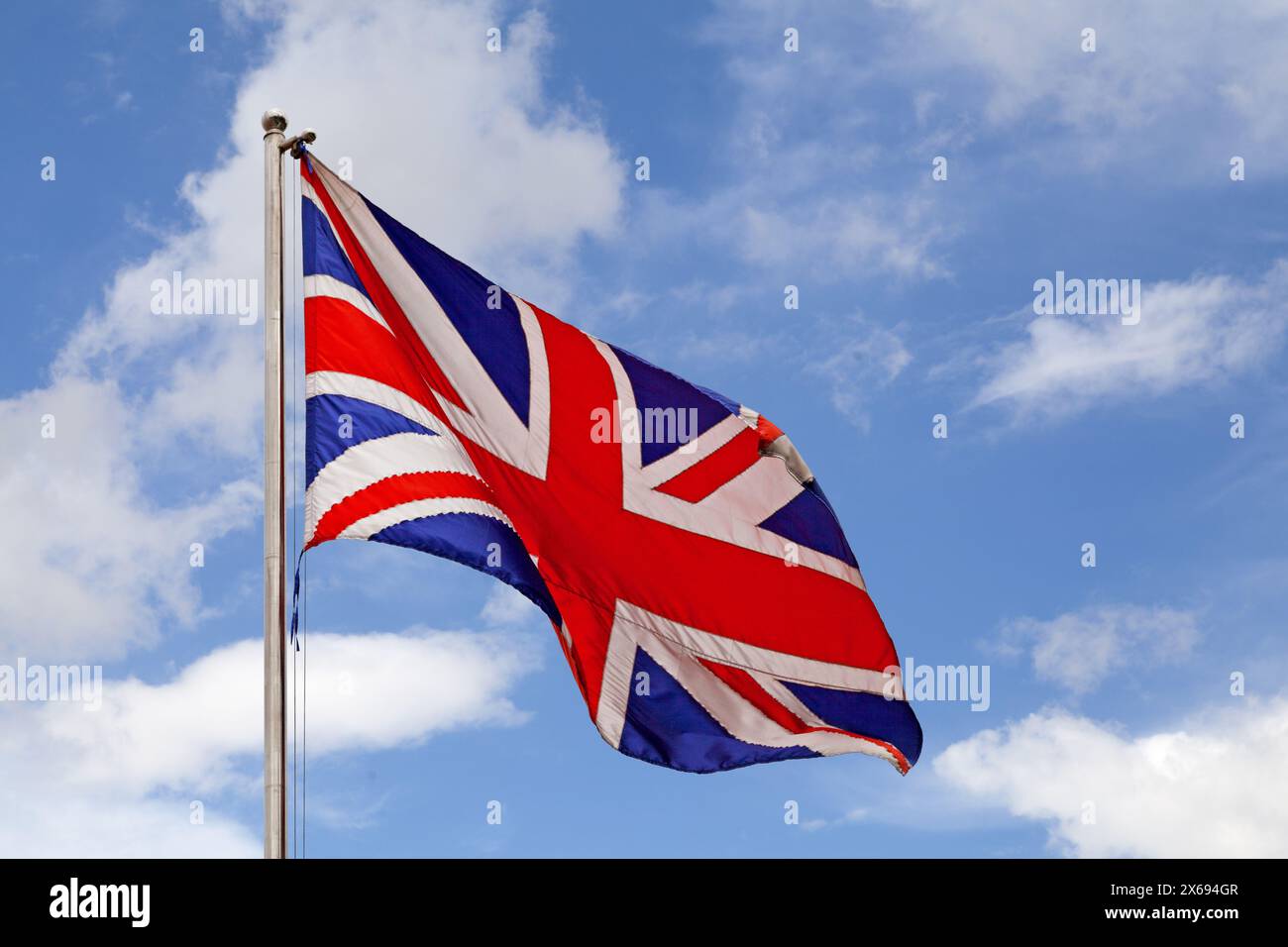 British flag waving in mid air Stock Photo - Alamy