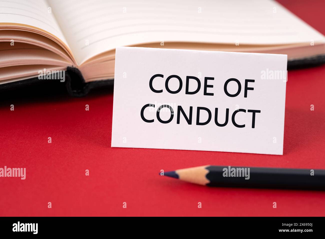 Code of conduct text on paper note red background Stock Photo - Alamy
