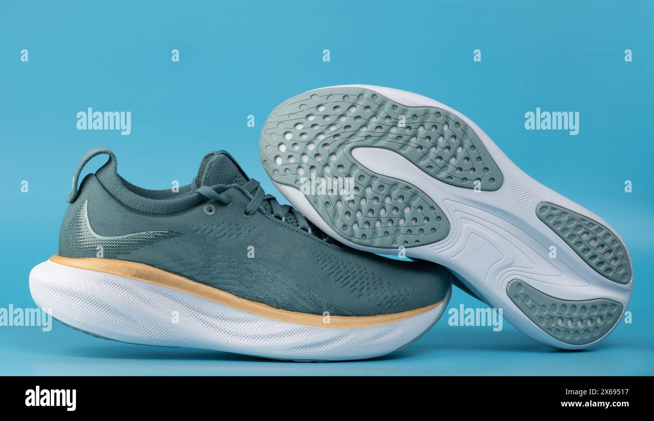 Pair of active green shoes side view with sole Stock Photo - Alamy