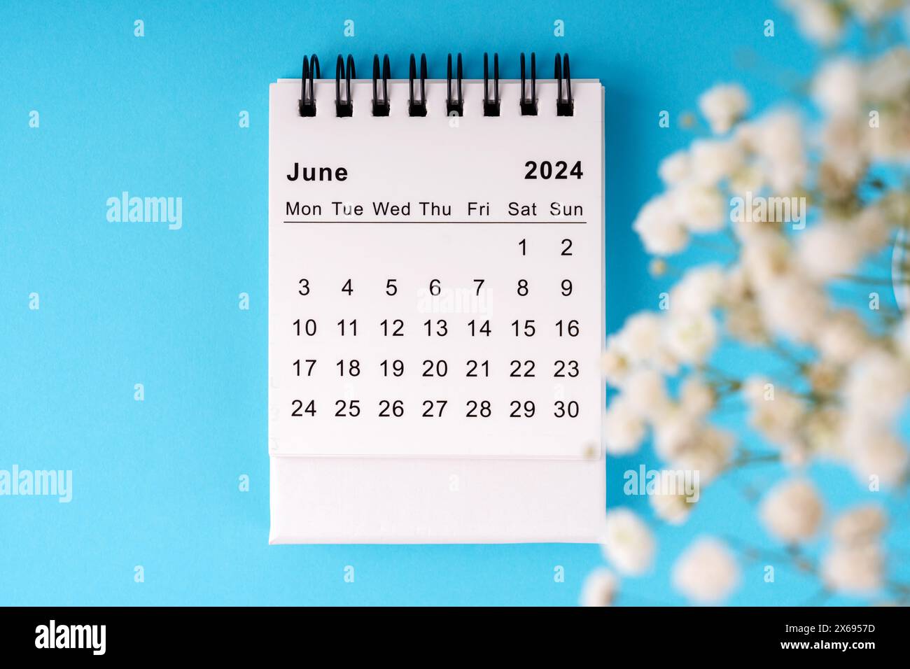June 2024 calendar flat lay blue background Stock Photo - Alamy
