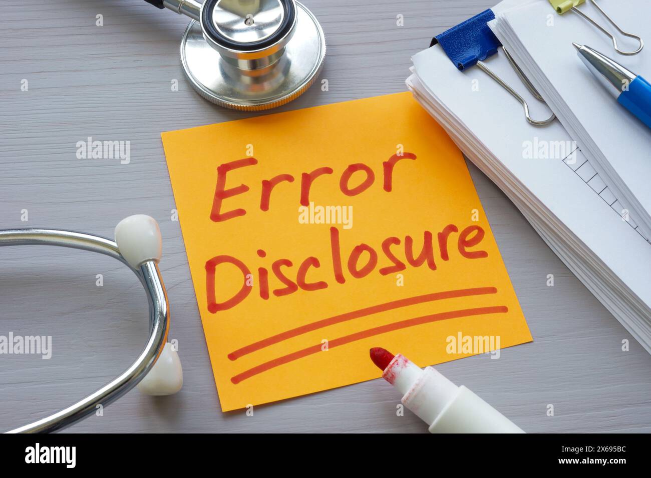 Stack of papers, medical stethoscope and note error disclosure Stock ...