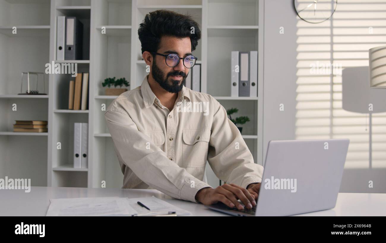 Indian male programmer standing hi-res stock photography and images - Alamy