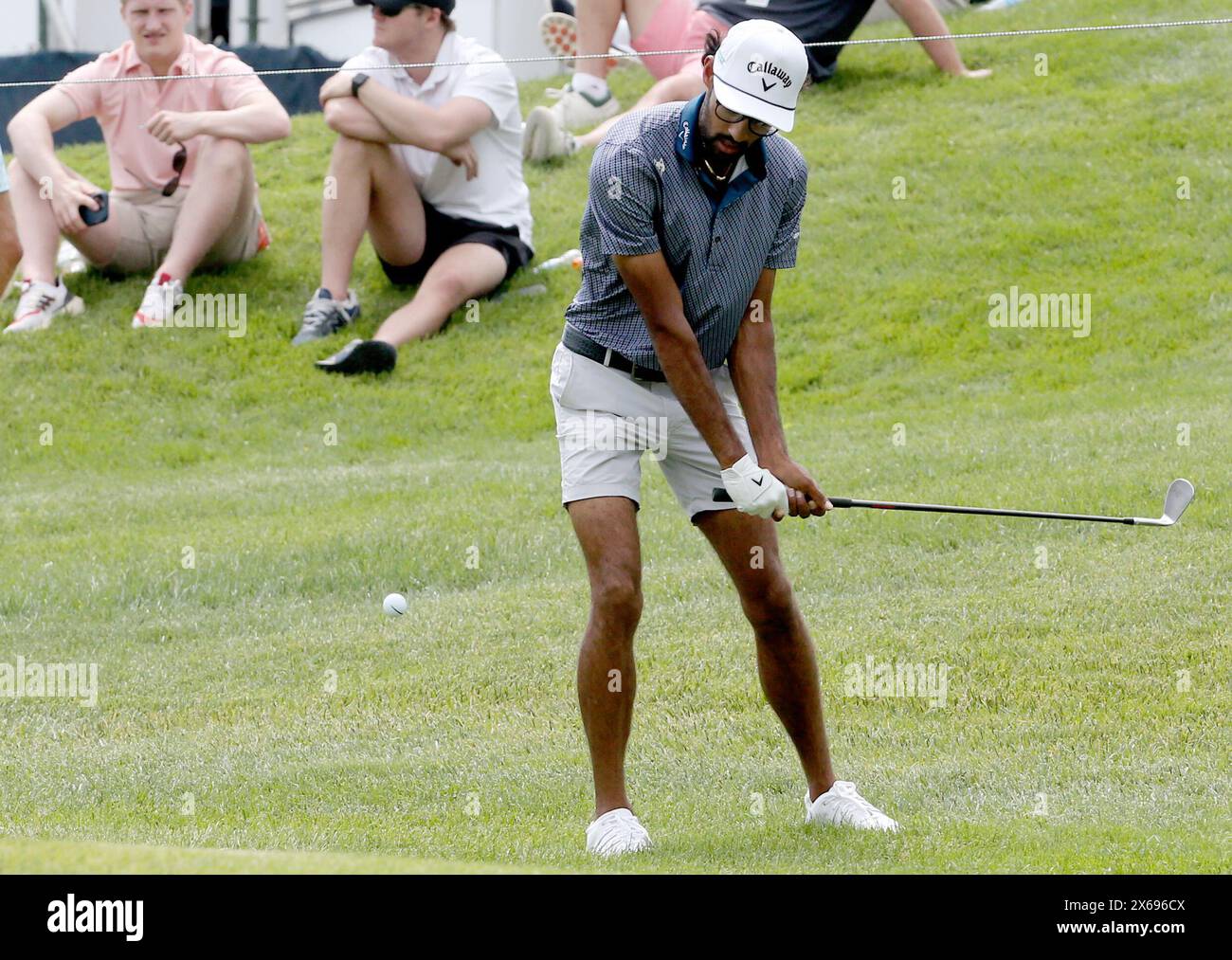 Akshay Bhatin chips onto the eleventh green during the first practice ...