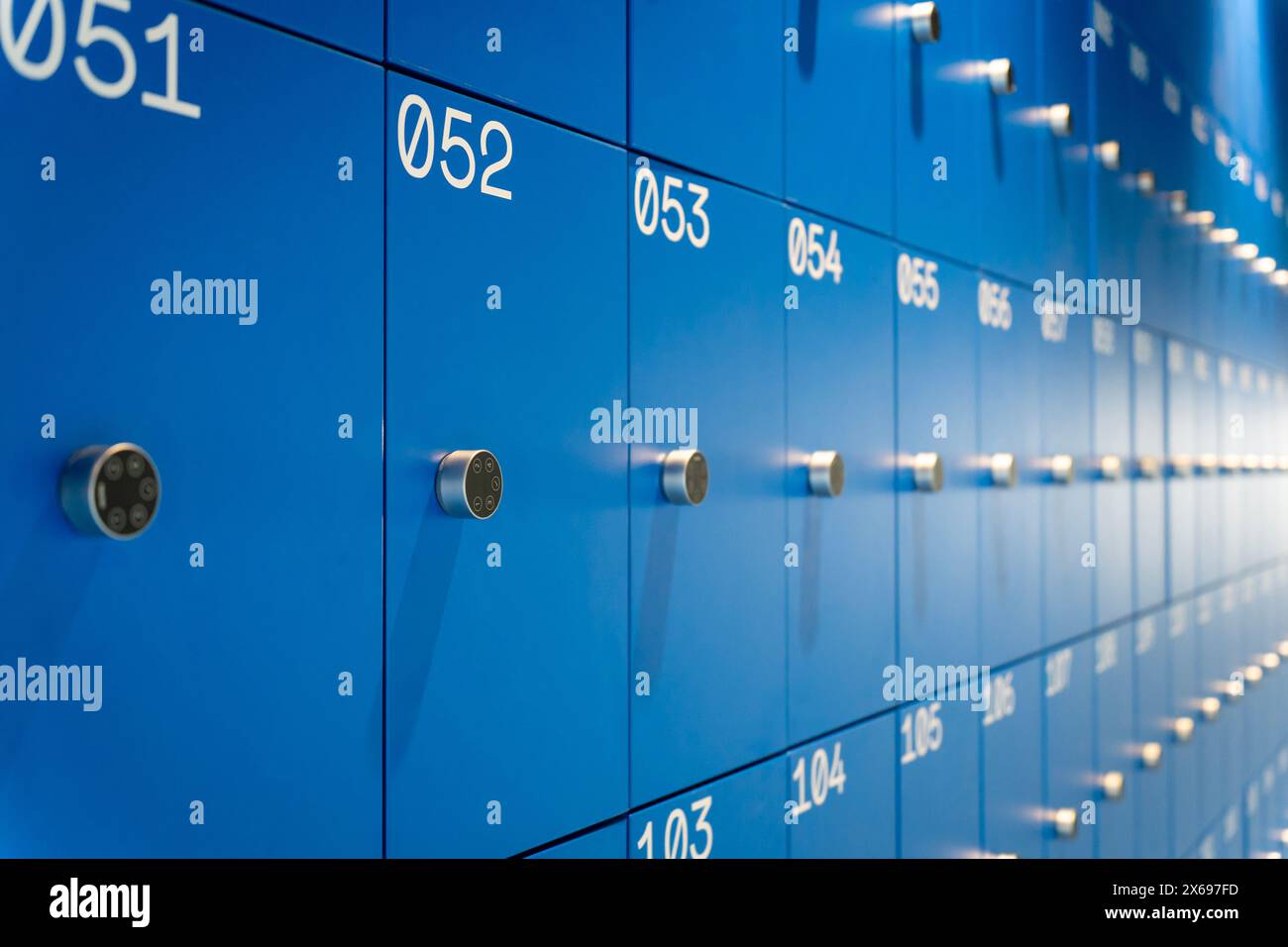 Row of blue lockers with number locks Stock Photo - Alamy