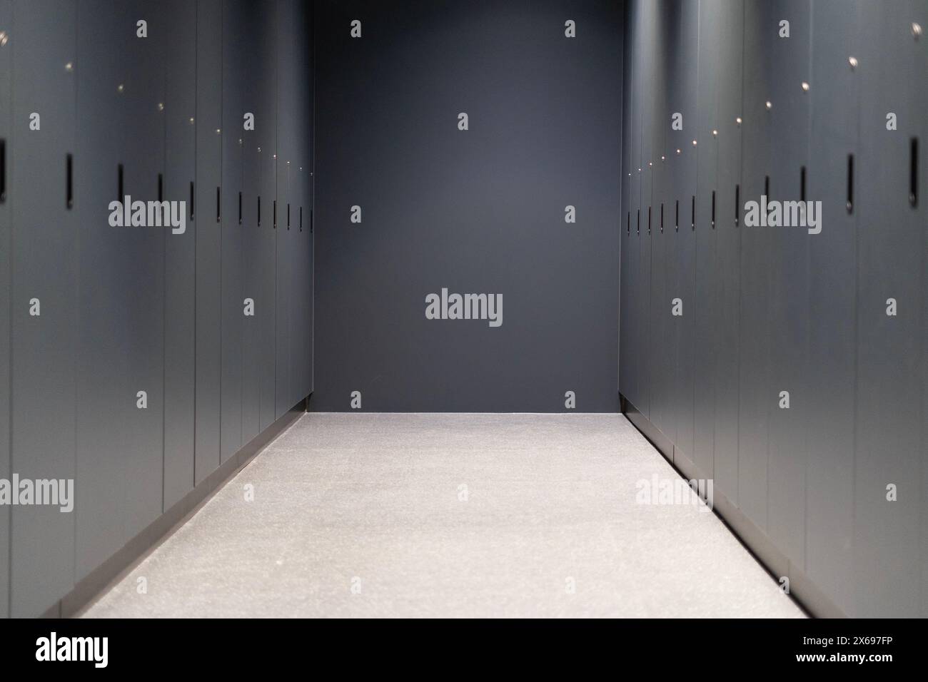A row of closed gray cabinets in a corridor Stock Photo - Alamy