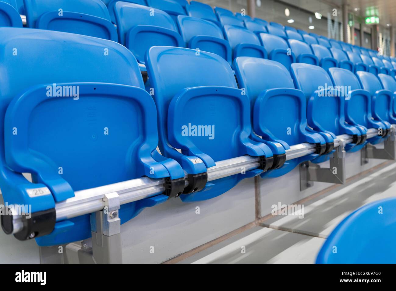 A long row of modern blue chairs with folding seats in a room Stock ...