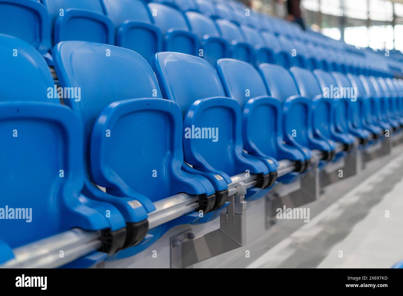 A long row of modern blue chairs with folding seats in a room Stock ...