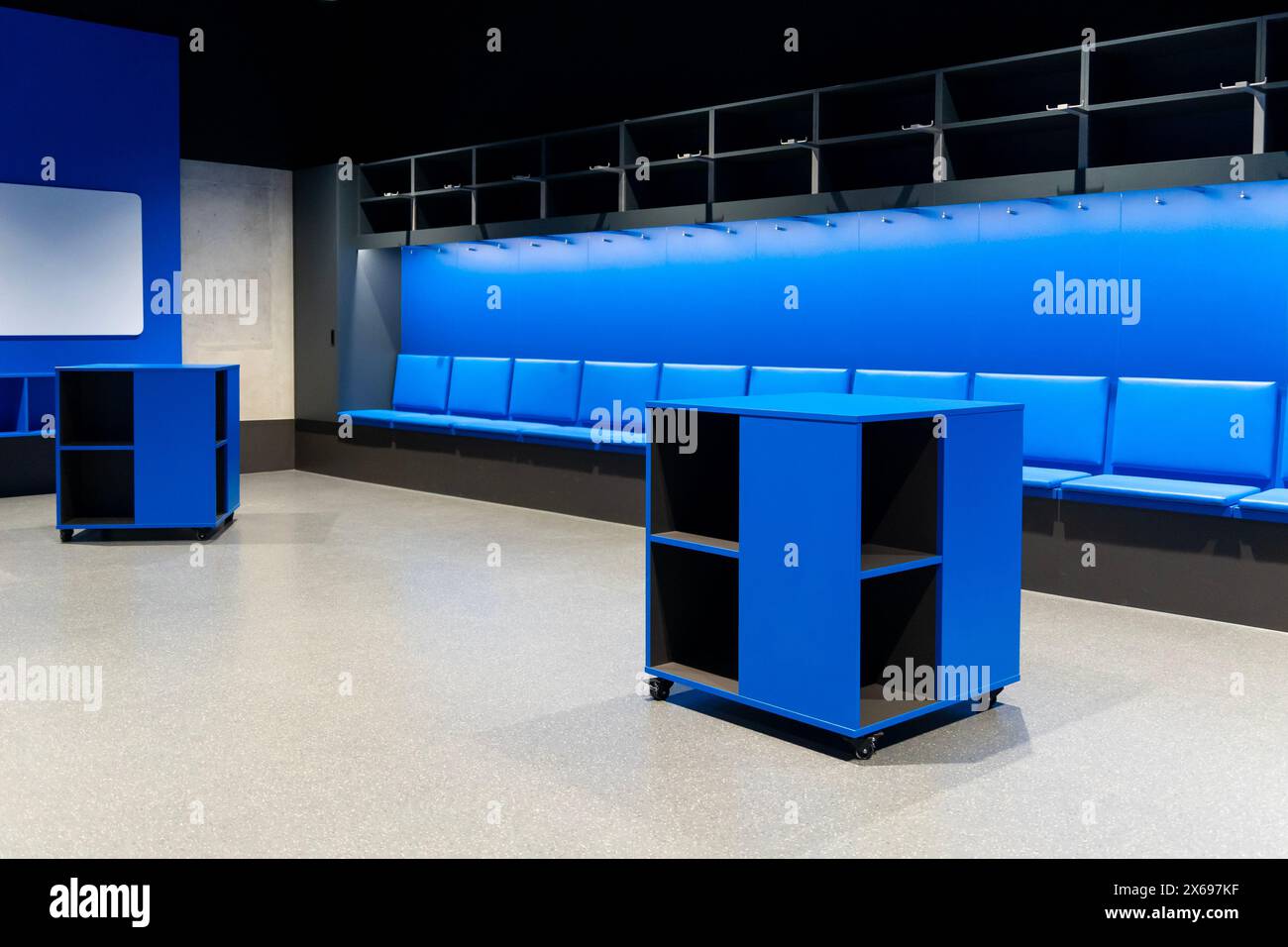 Modern empty sports locker room with blue furniture Stock Photo - Alamy