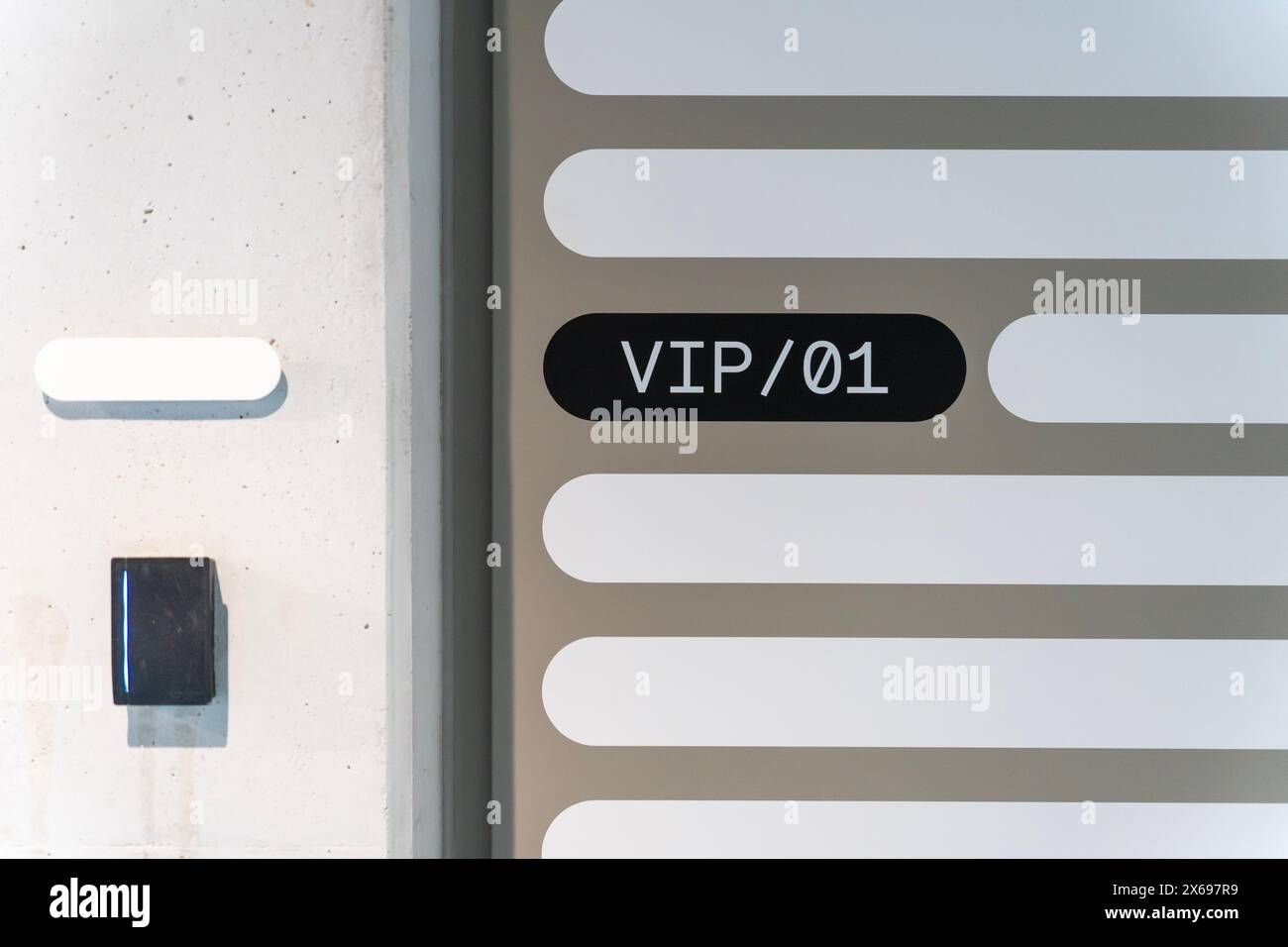 White and gray door with VIP inscription Stock Photo - Alamy