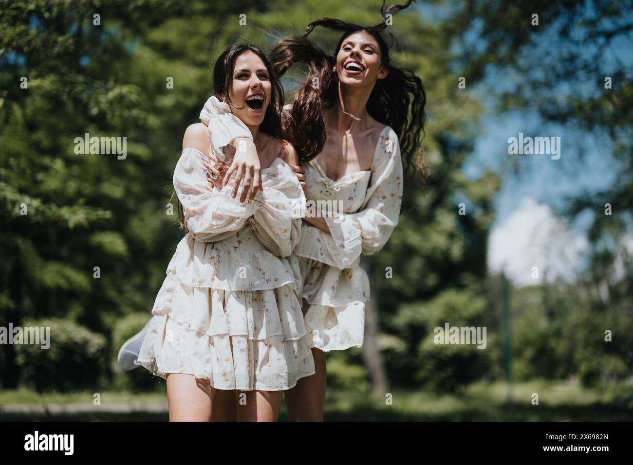 Woman in green hugging celebrating hi-res stock photography and images ...