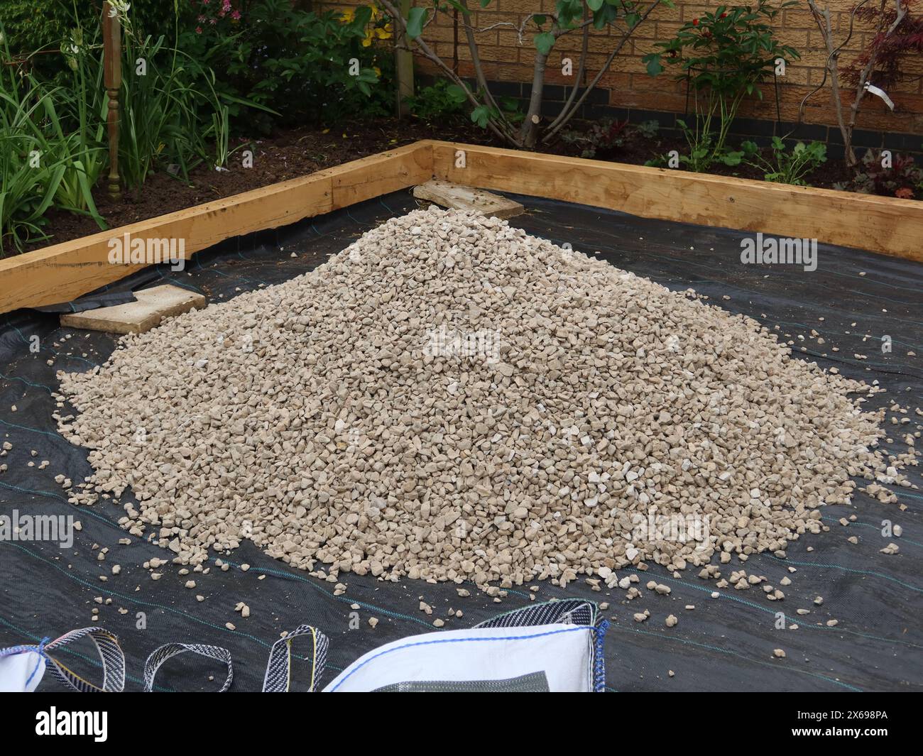 Garden make-over: level and compact the hard core, put in the edging ...
