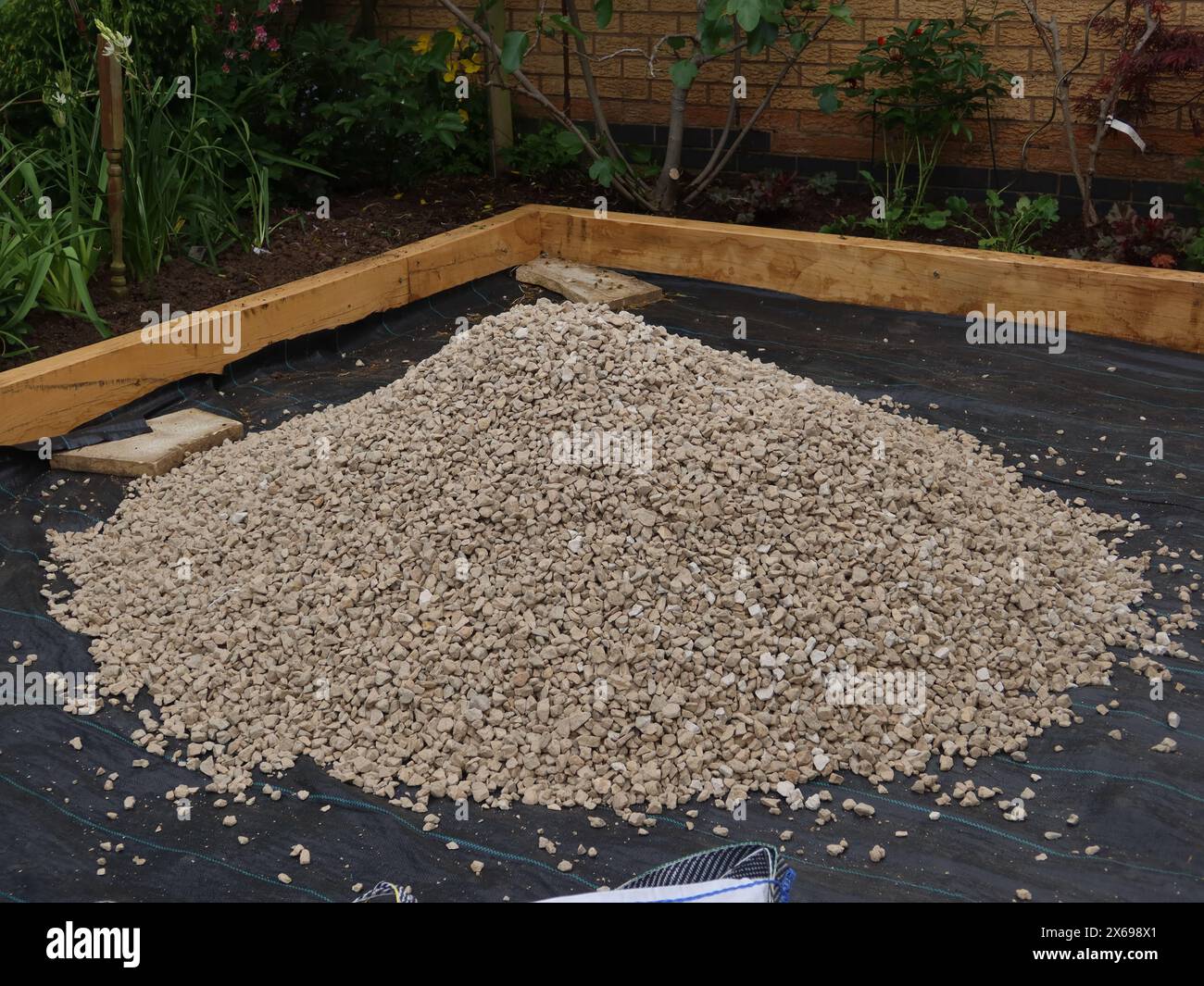 Garden make-over: level and compact the hard core, put in the edging ...