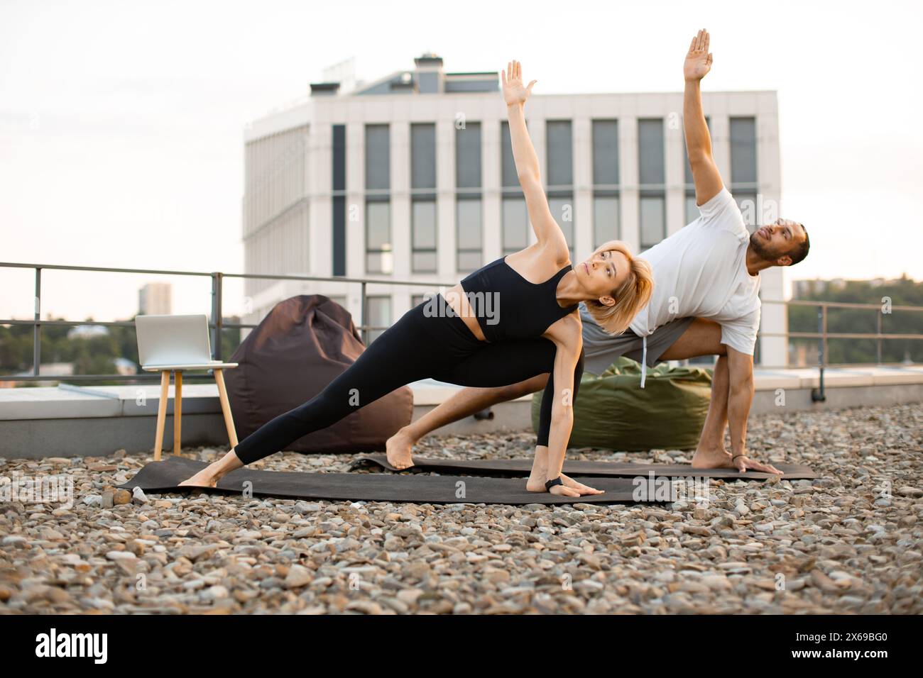 Sports family, husband and wife standing in yoga pose Stock Photo - Alamy