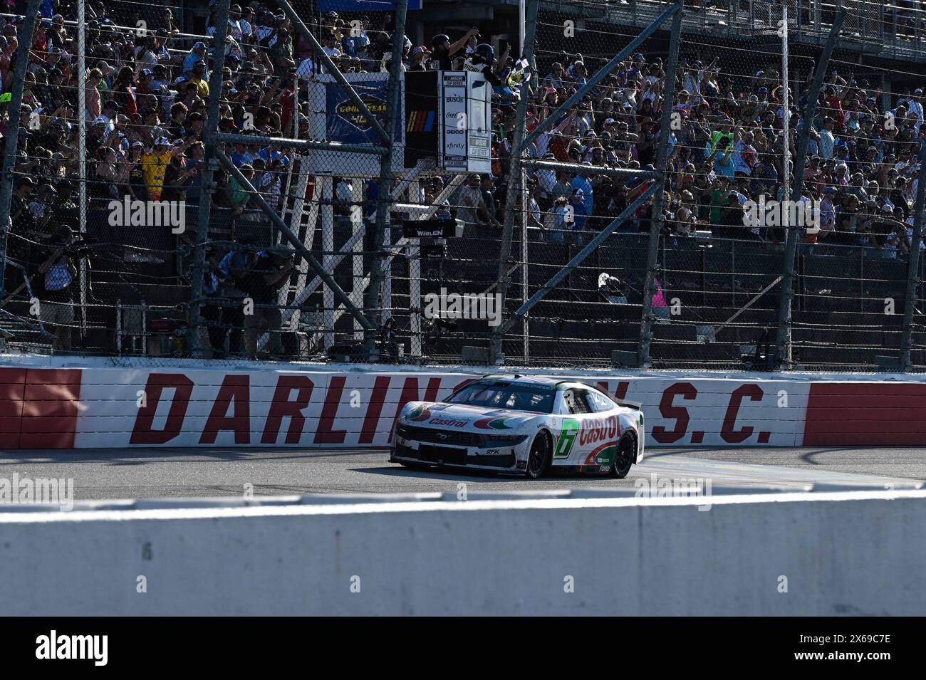 Brad Keselowski takes the checkered flag to win a NASCAR Cup Series auto race at Darlington ...