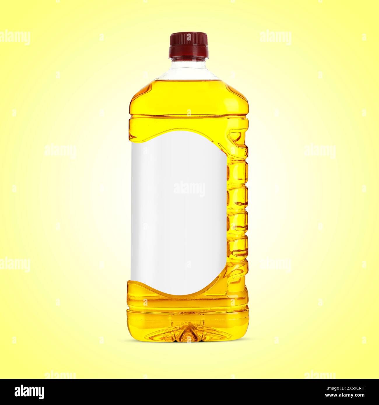 Cooking oil in plastic bottle with empty label on light yellow ...