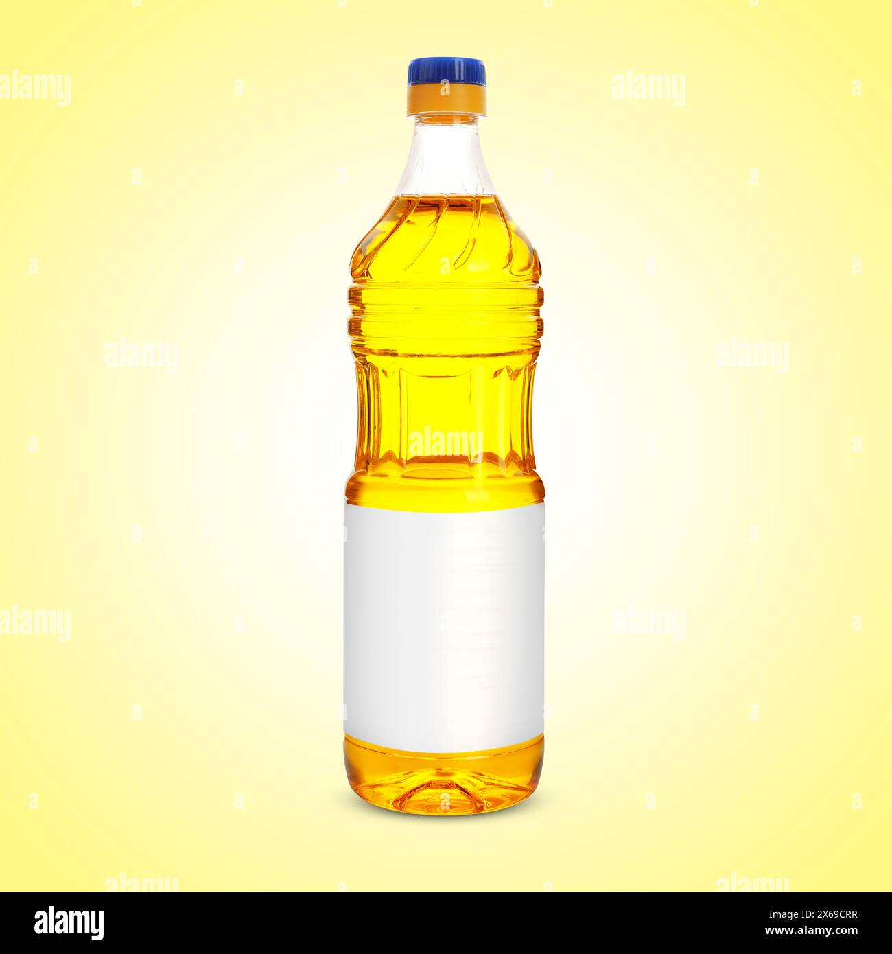 Cooking oil in plastic bottle with empty label on light yellow ...