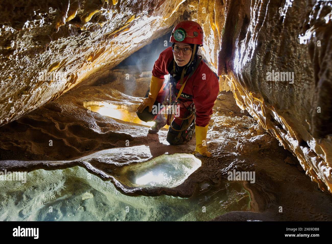 Cave explorer in the water basin corridor Stock Photo - Alamy