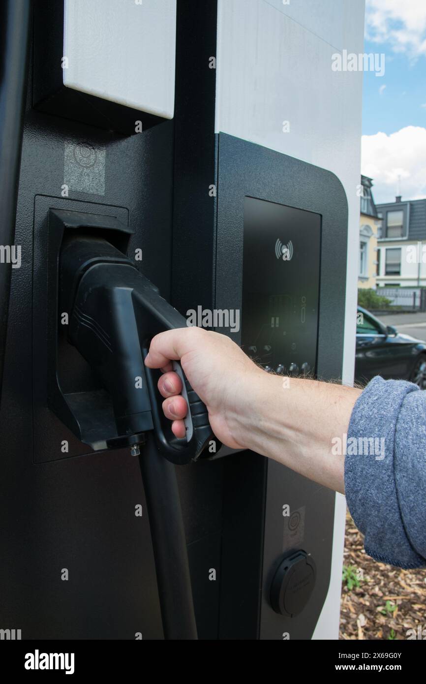 Hand holding gas pump in gas tank. Fuel, oil, gas filling - close up ...