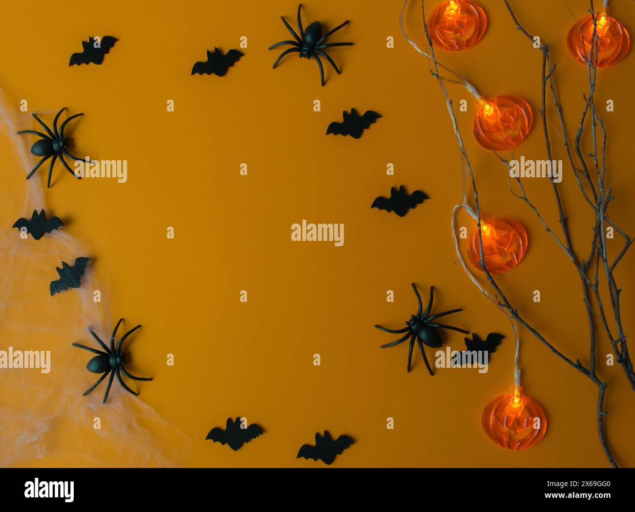 Halloween decorations, pumpkins, bats, web, bugs on orange background ...
