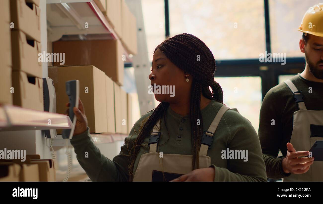Logistics coordinator and warehouse picker preparing orders for ...