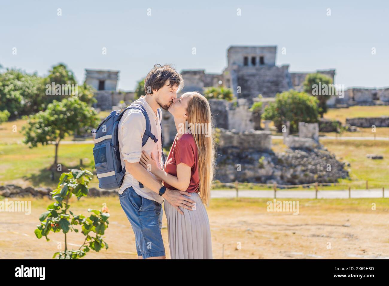 Couple man and woman tourists enjoying the view Pre-Columbian Mayan ...