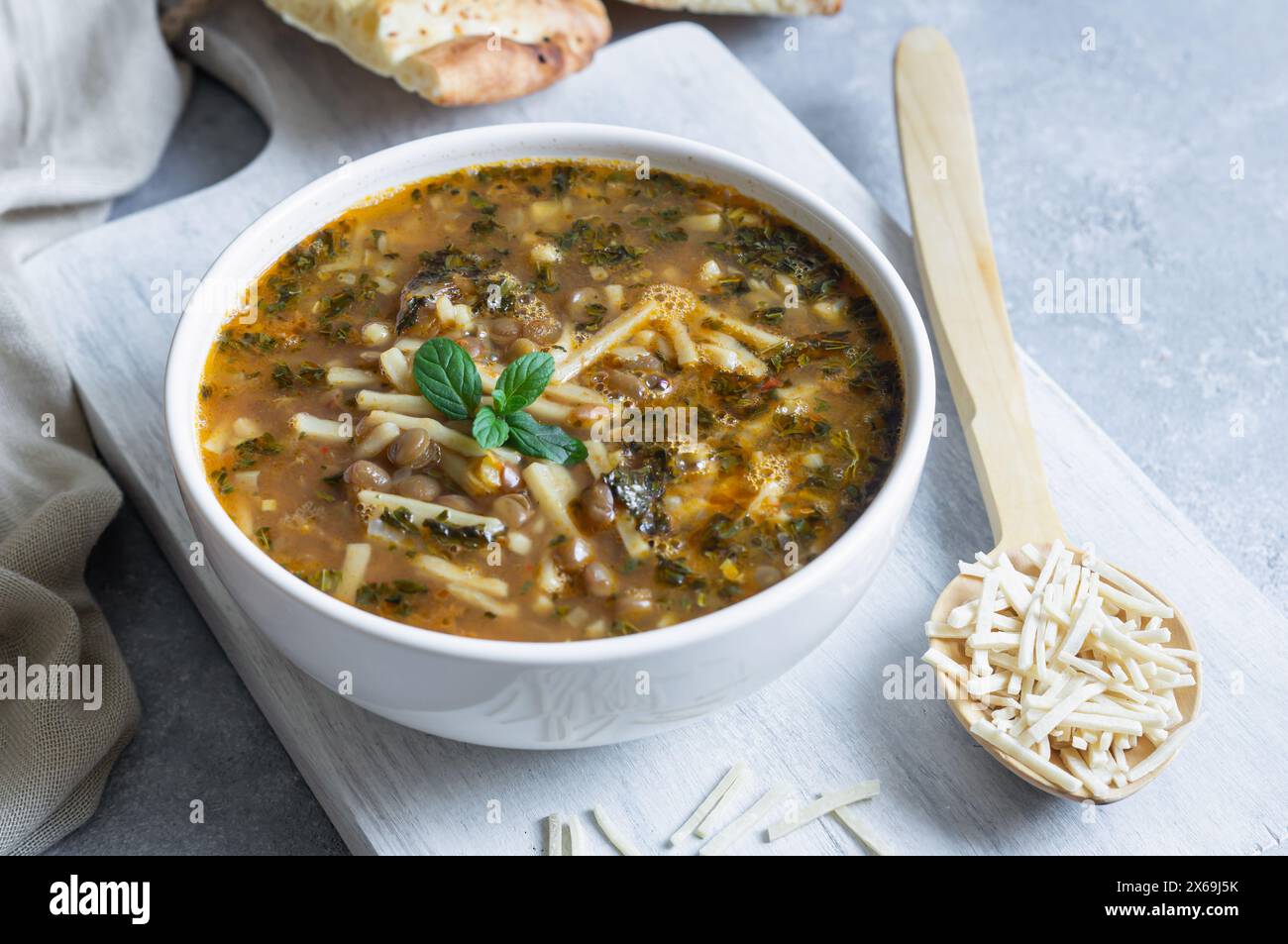 Traditional Turkish thin bar shaped dough soup, homemade noodle soup ...
