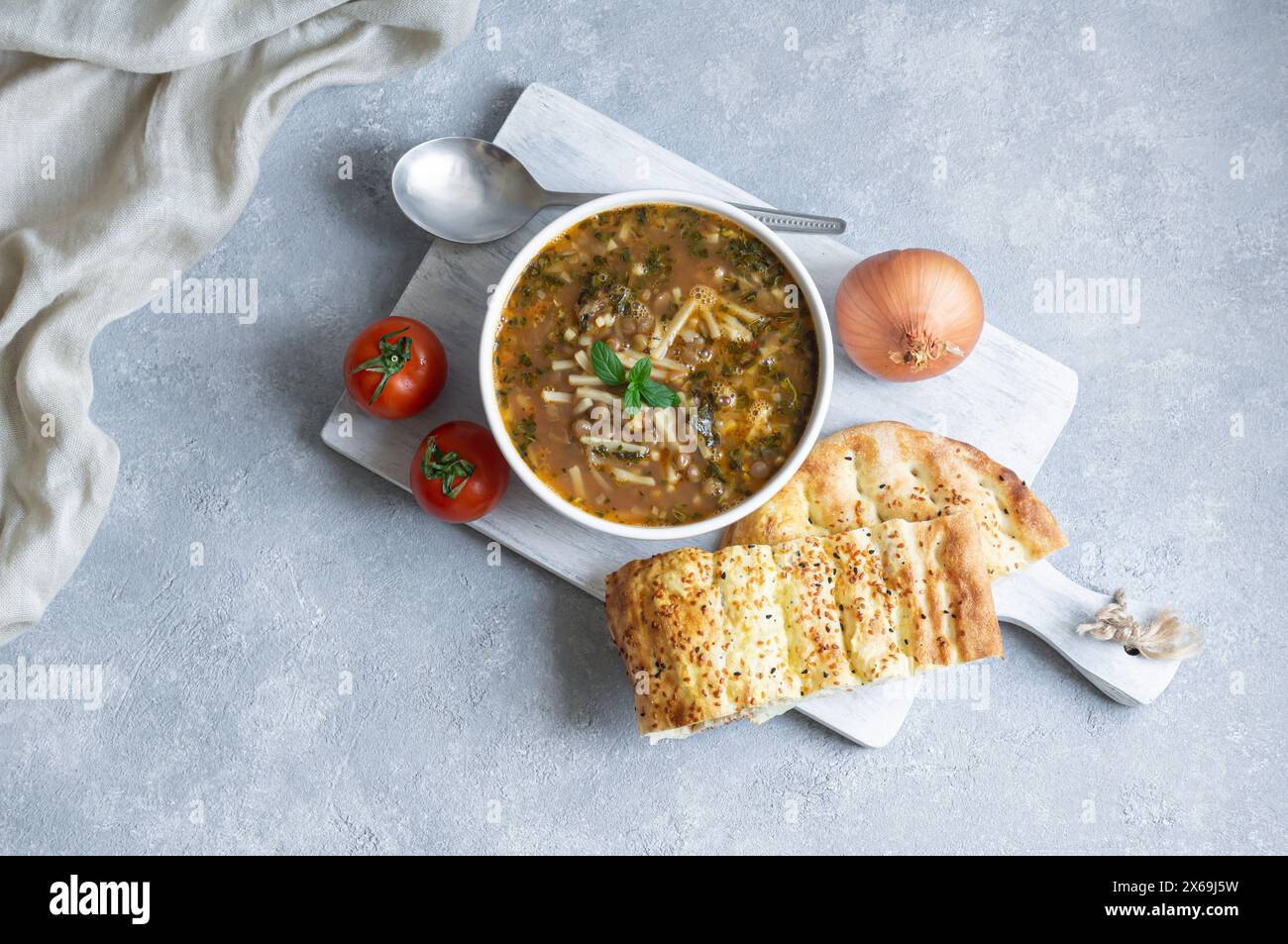 Traditional Turkish thin bar shaped dough soup, homemade noodle soup ...