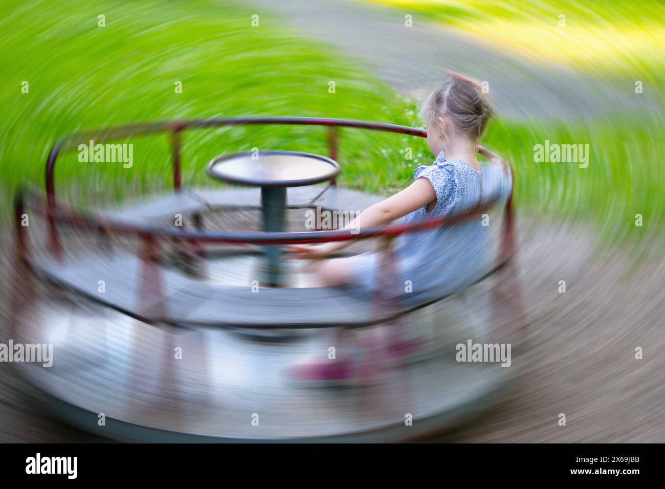 dizziness and balance, preschool girl, child spinning on carousel on ...