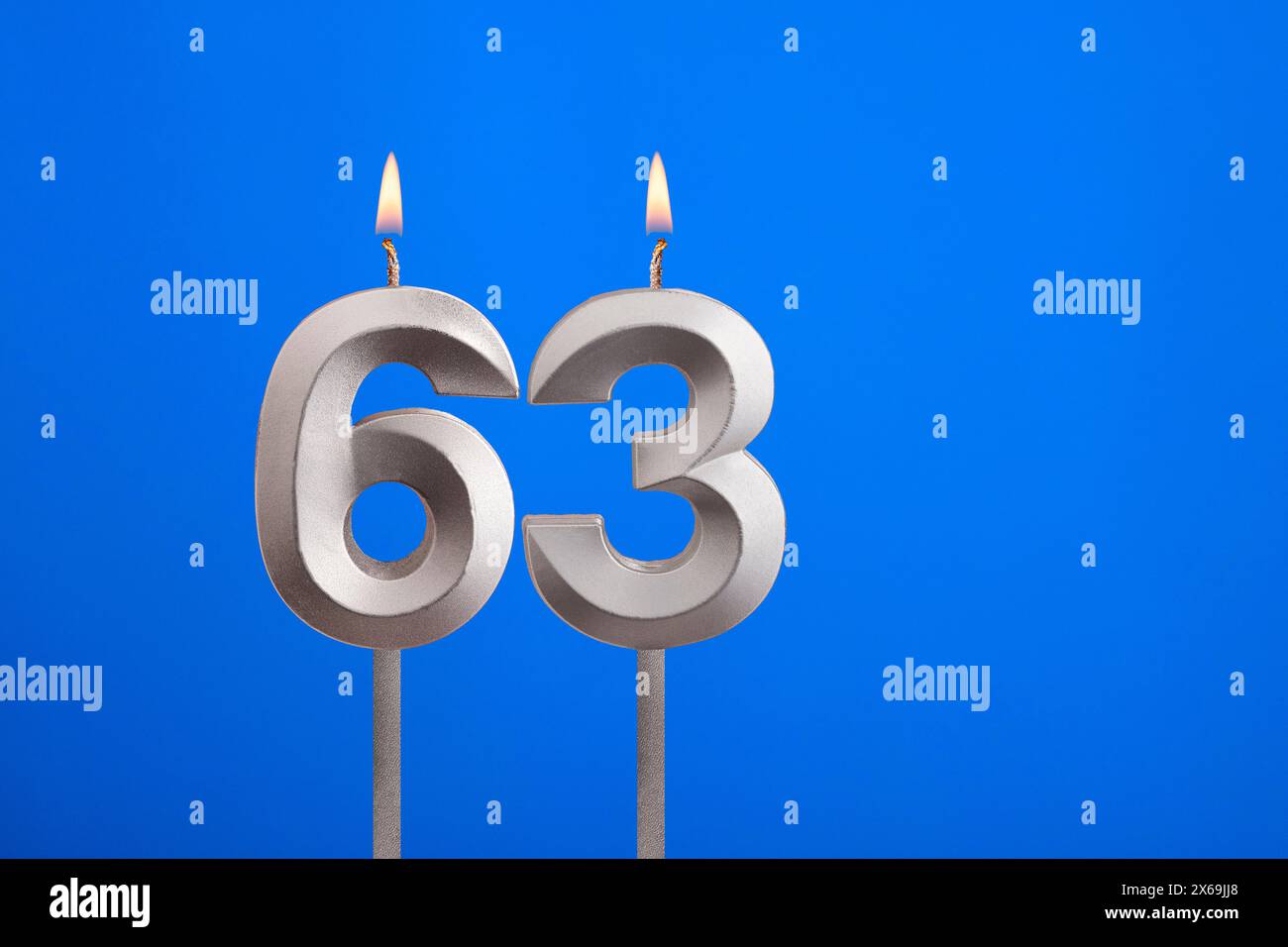 Birthday candle number 63 - Celebration card on blue background Stock ...