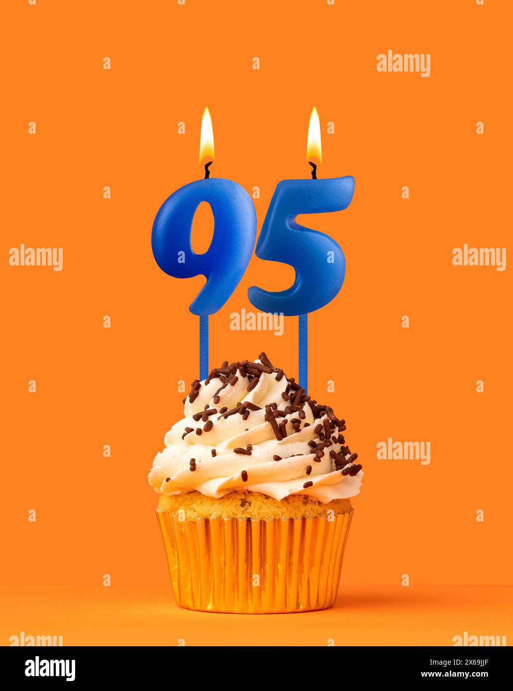 Blue candle number 95 - Birthday cupcake on orange background Stock ...