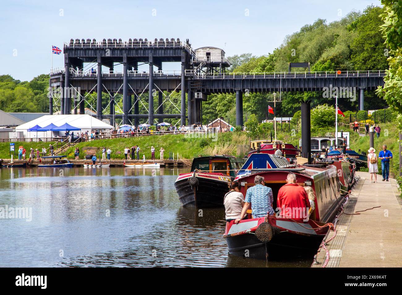 People on a canal narrowboat on the River Weaver during the open day ...