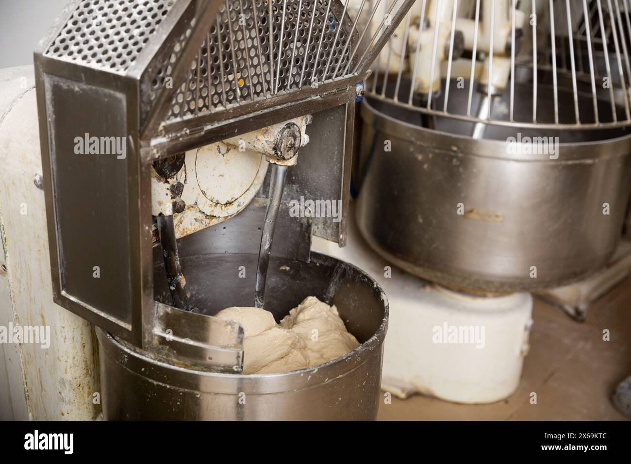 Making bread dough in kneading machine Stock Photo - Alamy