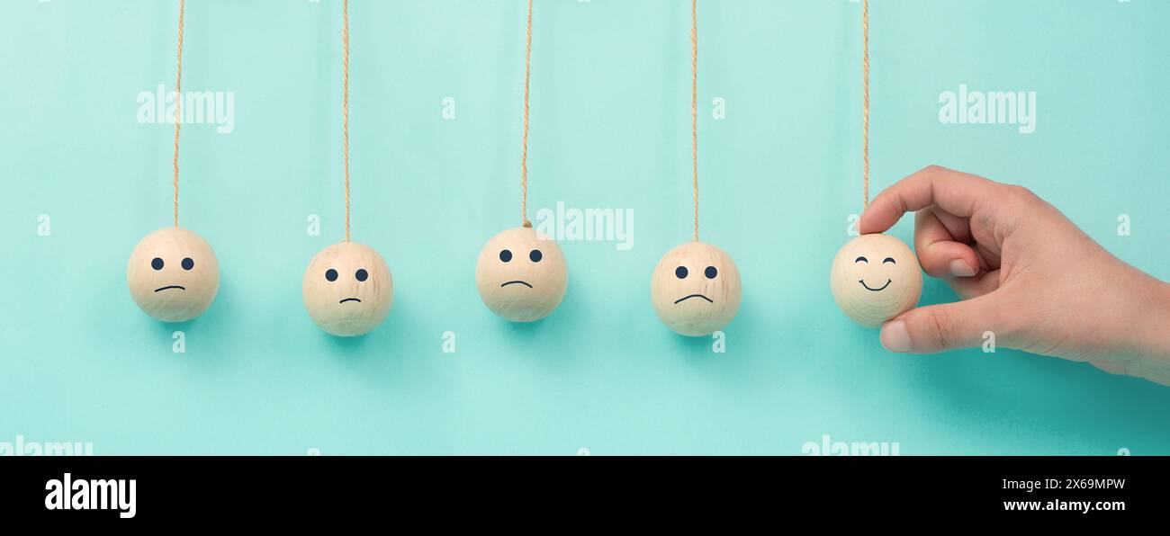 Happy smiling face spread happiness to sad faces, newton cradle concept ...