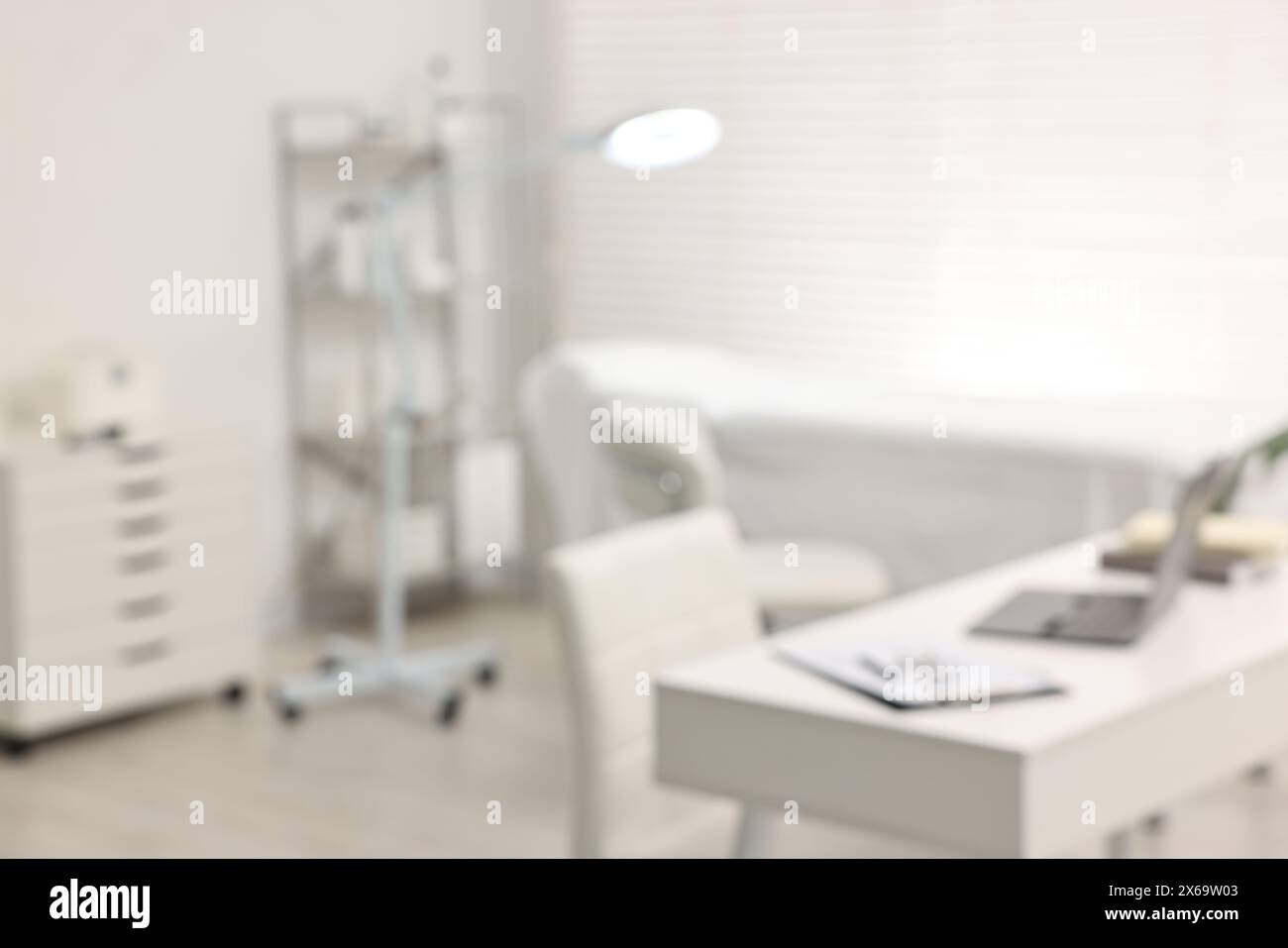 Blurred view of dermatologist's office with examination table Stock ...