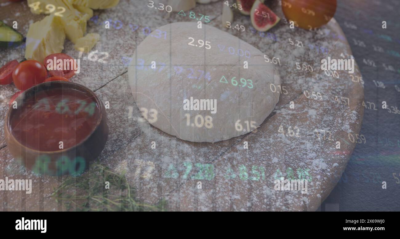 Image of changing numbers and graphs over pizza dough with sauce ...