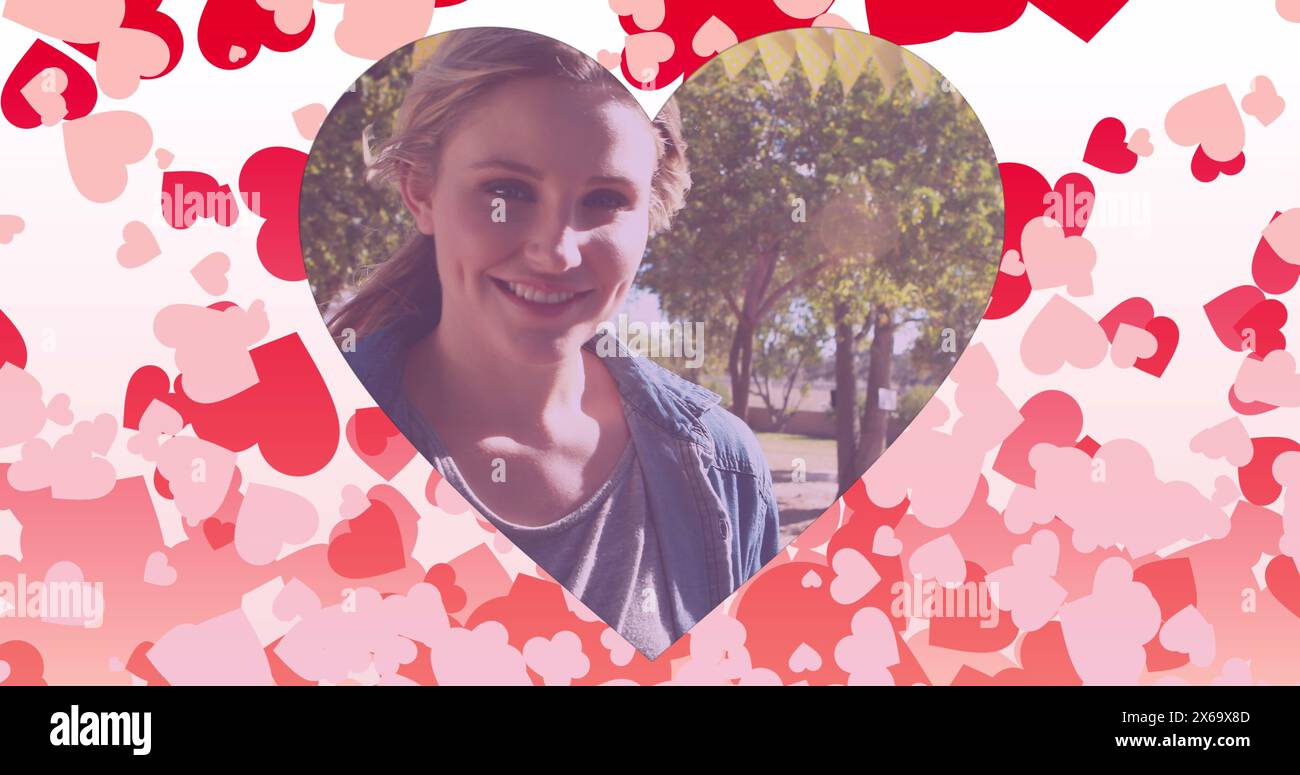 Image of hearts and heart frame over happy caucasian mother and ...